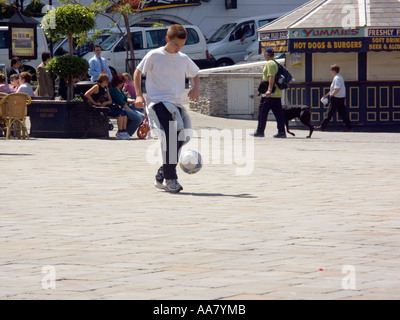 Boy playing football, Casemates Square, Gibraltar, Europe, boy playing ...