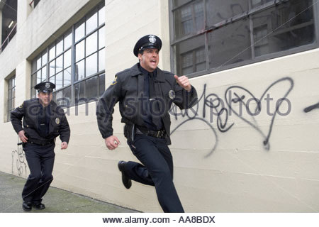 Male police officer running Stock Photo: 11368976 - Alamy