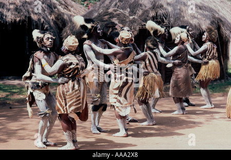 Kikuyu women in traditional dress singing and dancing to entertain ...