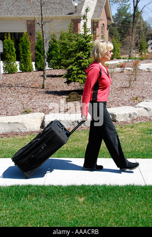 Female with suitcase Showing the concept of pulling and pushing pull ...