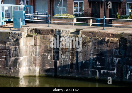 Stone dock walls shaped for and worn by the old dock gates Penarth ...