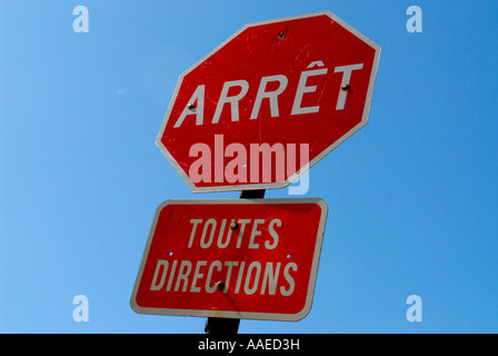 A stop signs in French only in Montreal, Canada: Arret Stock Photo - Alamy