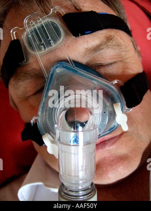 Tube and mask of the Obstructive Sleep Apnea CPAP Machine on a yellow ...