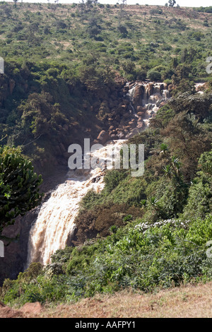 Waterfall with red brown water pouring over the escarpment near Kuch ...