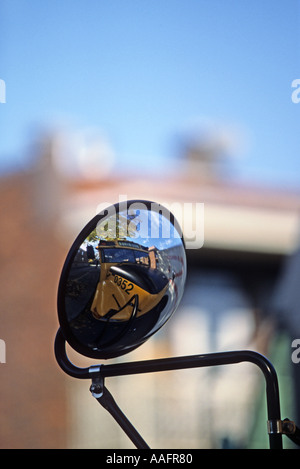 Schoolbus reflected in a wing mirror with ident number Stock Photo - Alamy