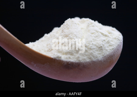 Spoonful of powdered milk Stock Photo - Alamy
