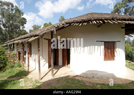 Emperor Menelik s old Palace with Ethiopian flag in Entoto hills above ...