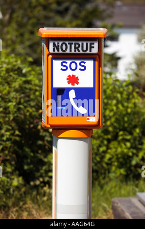 SOS phone. Emergency telephone at the roadside. Morning on the German ...