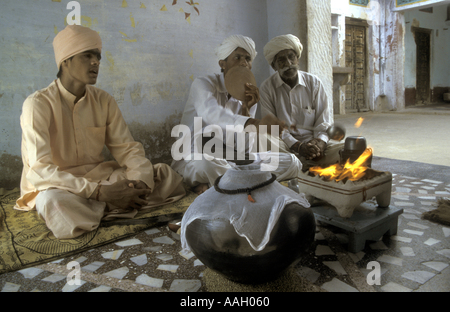 Bishnoi tribal men performing a pooja Rajasthan India Stock Photo - Alamy