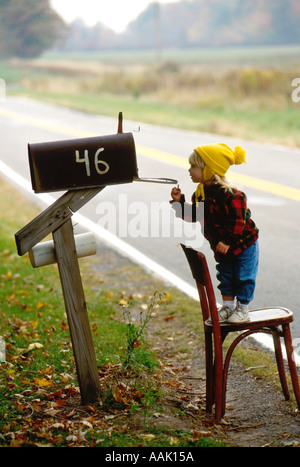 Little girl getting mail Stock Photo - Alamy