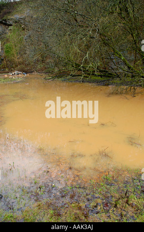 Discolored stream running out of Brofiscin Quarry, toxic waste was ...
