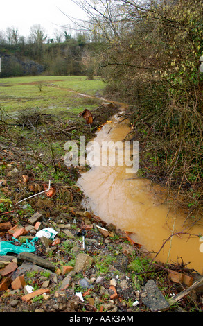 Discolored stream running out of Brofiscin Quarry, toxic waste was ...