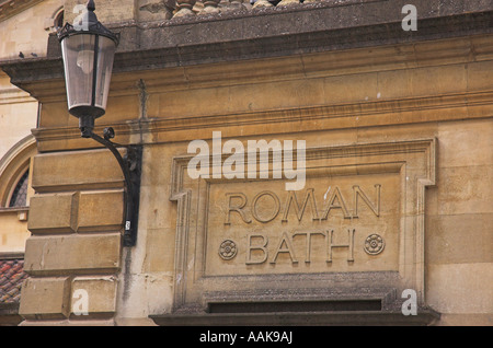 Stone carved sign at the Roman Baths with the Bath Abbey in the ...