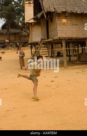 Kids playing ball, sepak takraw, in a village near Muang Ngoi Laos ...