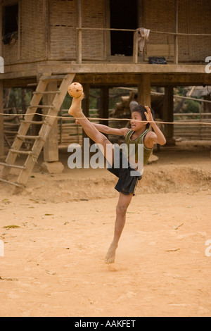 Kids playing ball, sepak takraw, in a village near Muang Ngoi Laos ...