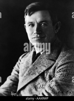 Will Rogers (1879-1935), American cowboy humorist, film star, entertainer, and writer, holding ...