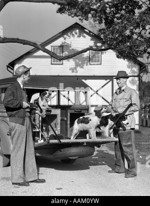 1940s YOUNG MAN HUNTER WITH SHOTGUN AND HUNTING DOG HOLDING BIRD ...