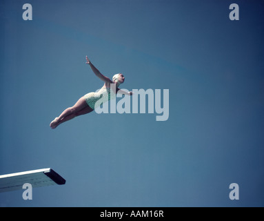 1950s WOMAN SWAN DIVE OFF DIVING BOARD ONE PIECE BATHING SUIT CAP Stock ...