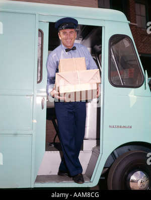 1950s 1960s SMILING MAN DELIVERY DRIVER WEARING CAP AND UNIFORM LOOKING ...