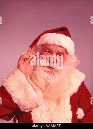 Old fashioned Santa Claus figure in front of fir tree decoration Stock ...
