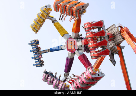 Tivoli ride in a fast spinning attraction Stock Photo - Alamy