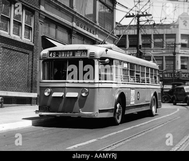1930s 1940s TRACKLESS TROLLEY ELECTRIC BUS ABOUT TO ROUND CURVE PUBLIC ...