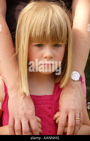 Small Child Clinging to Mother Stock Photo - Alamy