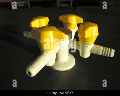 Gas taps on school science department bench Stock Photo - Alamy