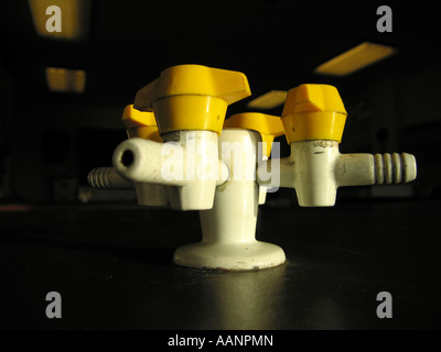 Gas taps on school science department bench Stock Photo - Alamy