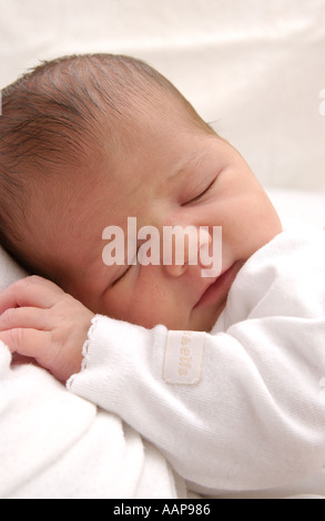 Newborn Baby Sleeping Smiling. Cute Infant Child Stock Photo - Alamy