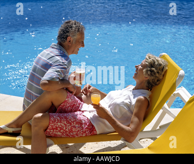 Spain, Senior couple swimming in sea Stock Photo - Alamy
