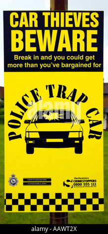 Warning to Car Thieves poster in underground car park, London, UK Stock ...