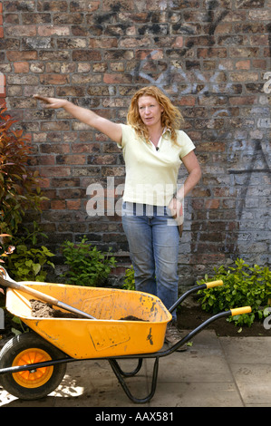 Charlie Dimmock One Of The Groundforce Team Installing A Water Feature Charlie Dimmock One Of The Groundforce Team Installing A Water Feature