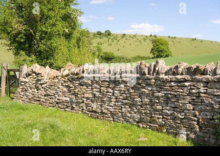 A dry stone wall and a rolling Cotswold landscape near the Cotswold ...