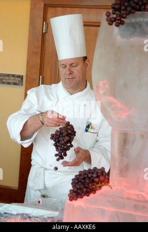 Chef Garnishing Ice Sculpture Stock Photo - Alamy