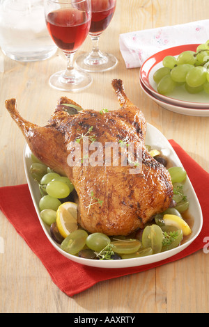 Duck Roast with Table Grapes Stock Photo - Alamy