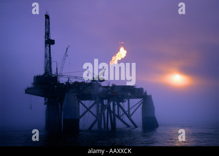 Submersible type rig flare testing a newly completed well offshore ...
