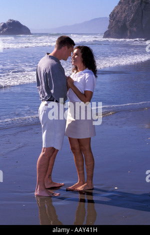 Loving couple holding hands in car close-up Stock Photo - Alamy