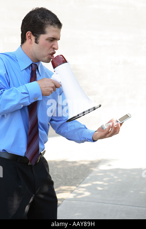 Young person shouting in loudspeaker Stock Photo - Alamy