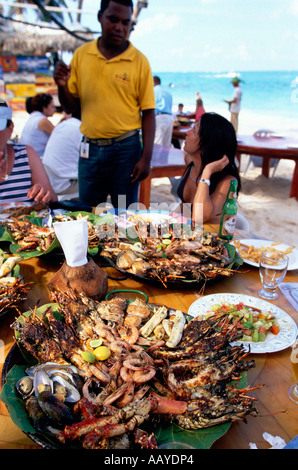 Waiter serving dishes at Captain Cook Restaurant Bavaro Punta Cana ...
