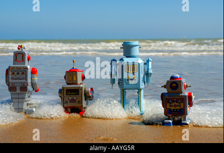 Four robots on the beach Stock Photo - Alamy