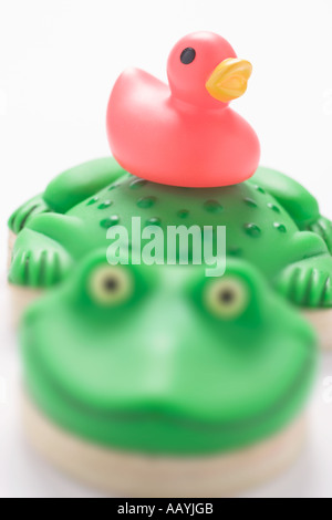green frog rubber bath toys on blue background Stock Photo - Alamy
