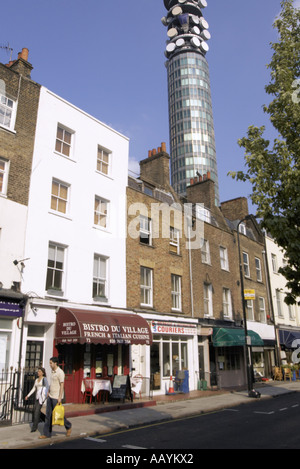 Fitzrovia street scene Post Office Tower London and black cab taxi and ...