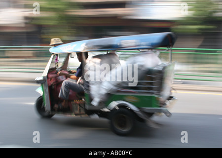 Fully loaded tuk-tuk in Bangkok, Thailand Stock Photo - Alamy