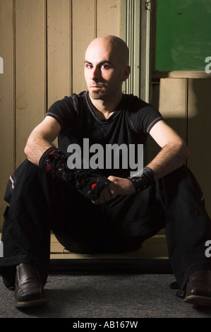 Sinister character illuminated by harsh lighting Stock Photo - Alamy