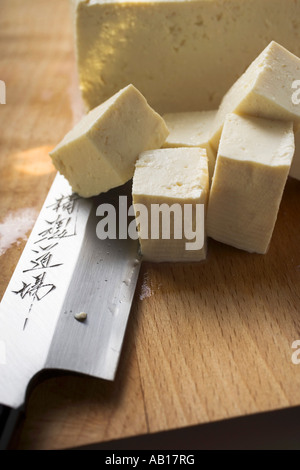 Block of tofu diced tofu and Asian knife FoodCollection Stock Photo - Alamy