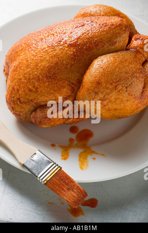 Fresh marinated chicken with basting brush FoodCollection Stock Photo ...