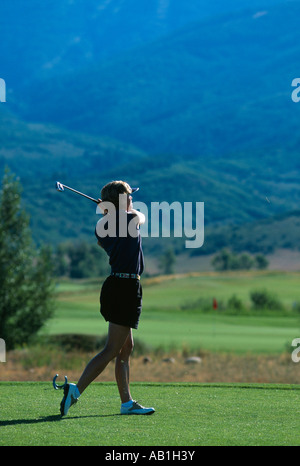 Golfer teeing off Haymaker golf course Steamboat Springs Colorado USA ...