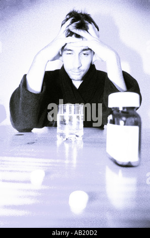 The man suffering hangover after christmas party Stock Photo - Alamy