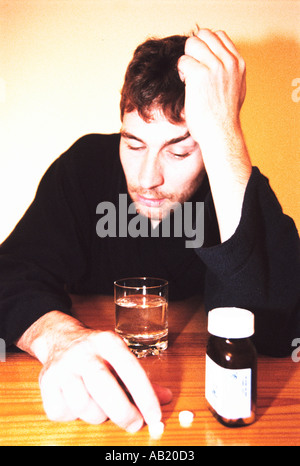 Man suffering hangover after christmas party Stock Photo - Alamy